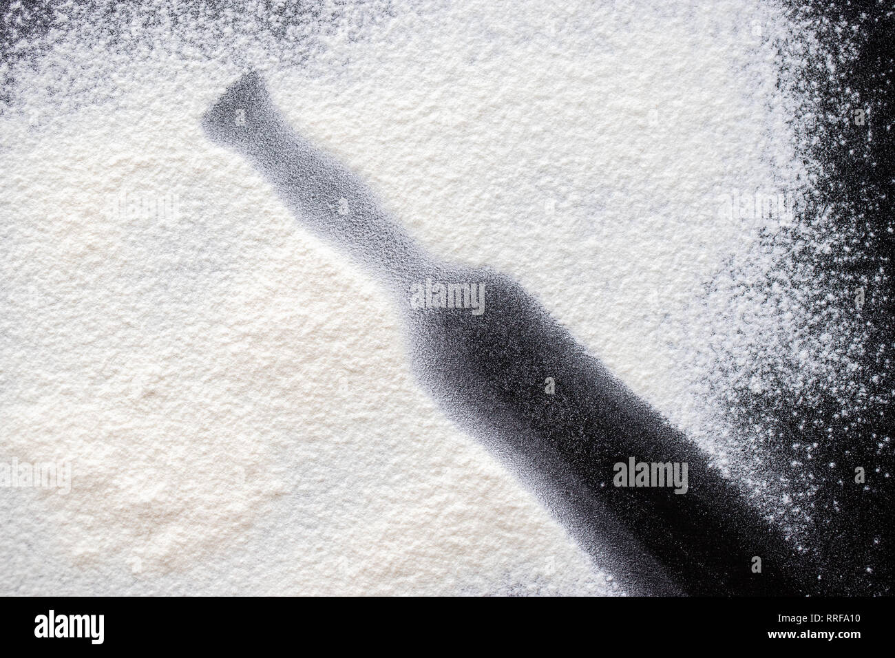 Flour on black background Stock Photo - Alamy