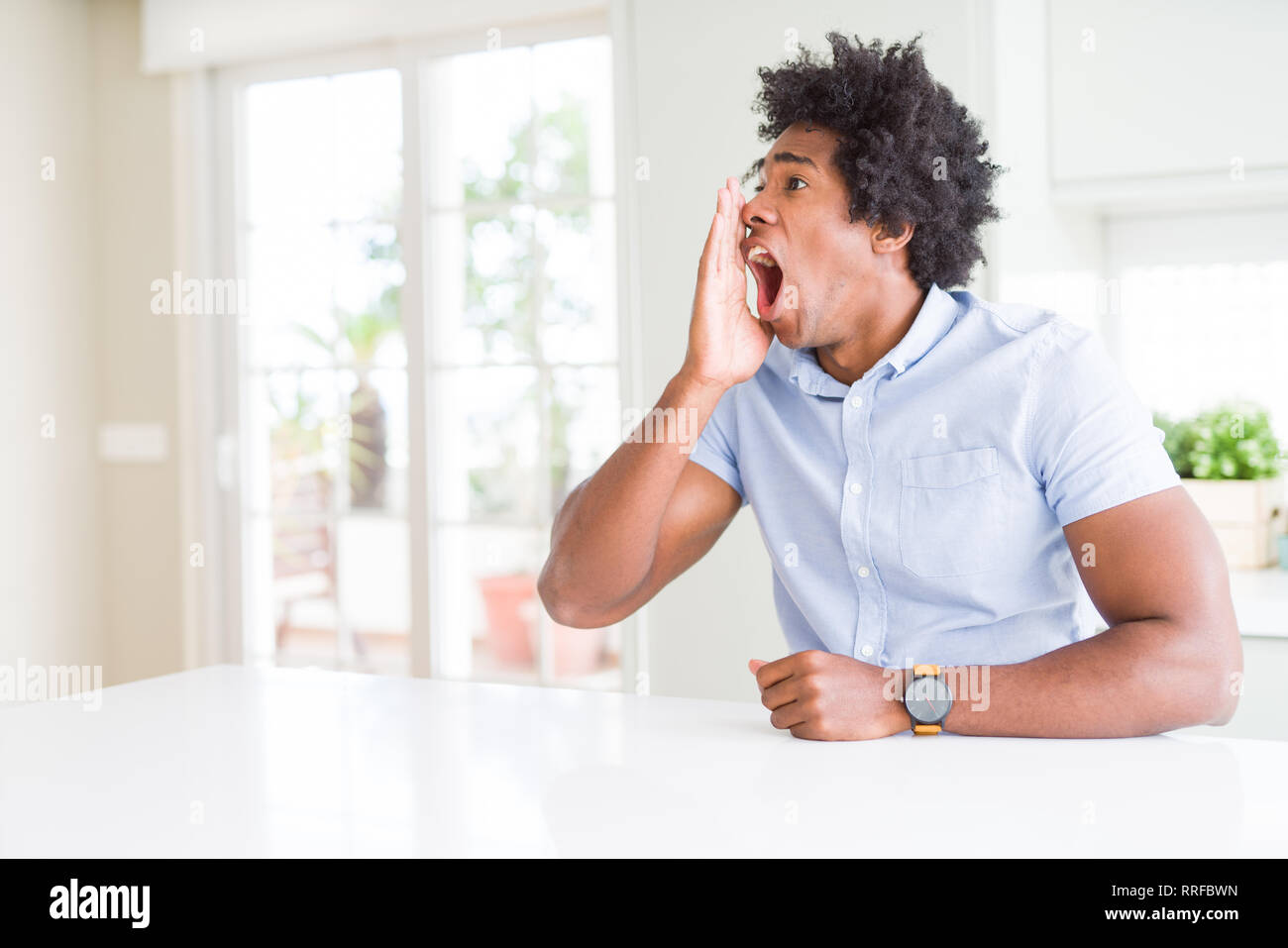 African American business man shouting and screaming loud to side with ...