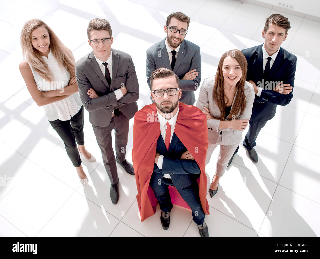 top view.businessman-Superman and his business team standing together ...