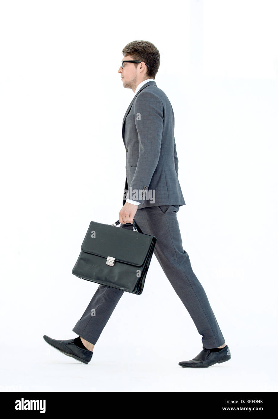 side view. a businessman with a leather briefcase comes forward Stock ...
