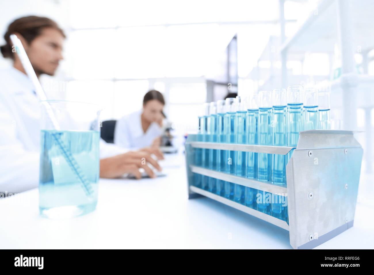 side view of scientists working in laboratory Stock Photo - Alamy