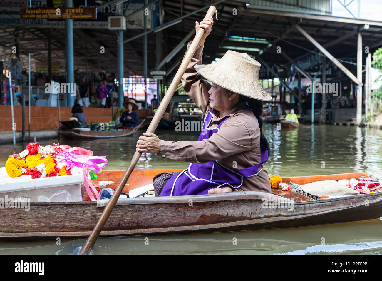 Damnoen Saduak, Thailand - August 29, 2018: Woman selling garlands from ...