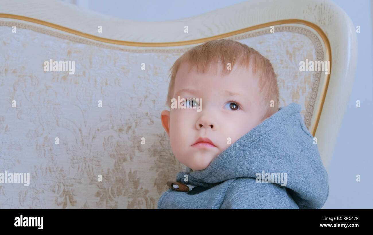 Portrait of pensive little boy Stock Photo - Alamy