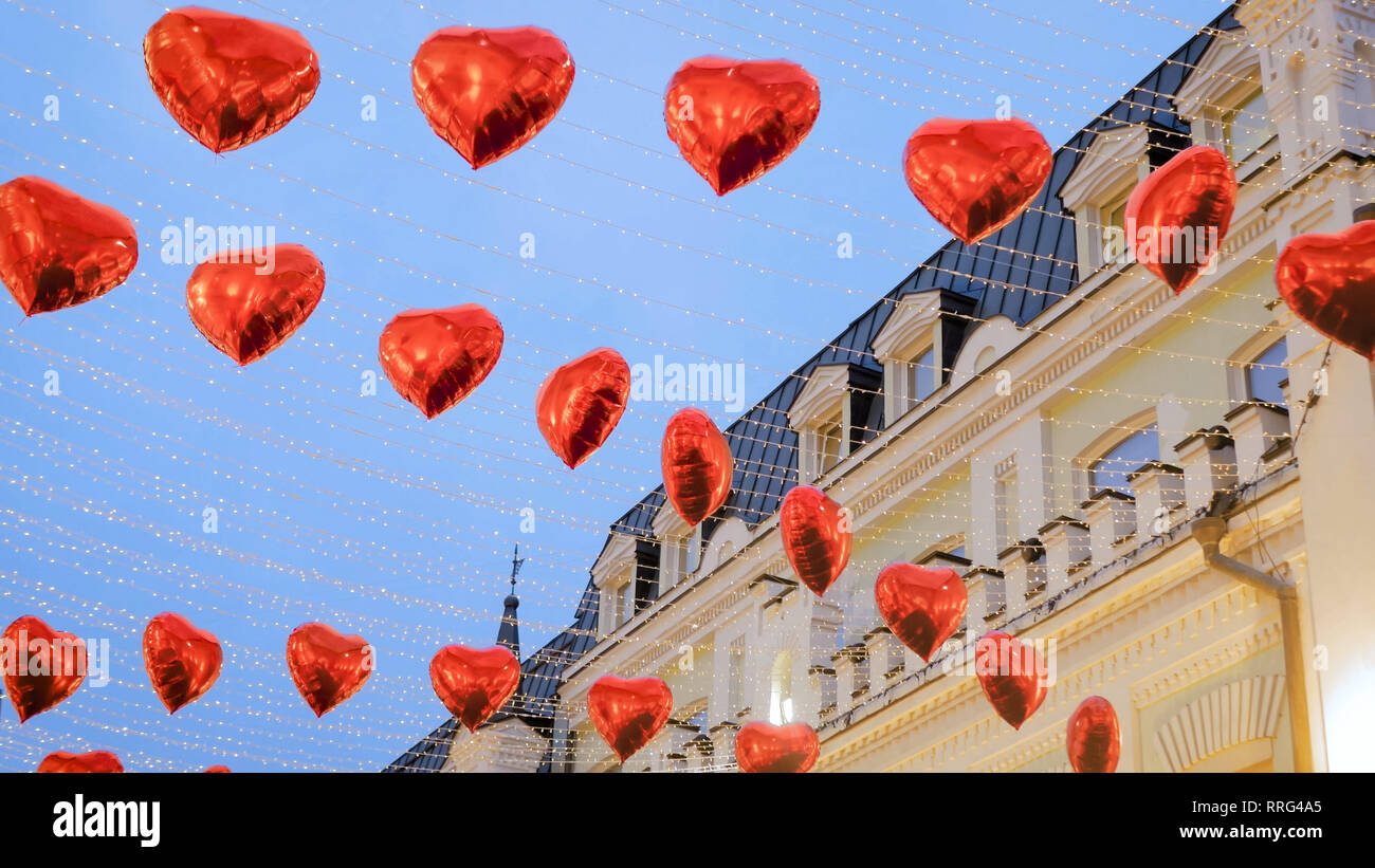 Red heart shape balloons waving in the wind Stock Photo - Alamy