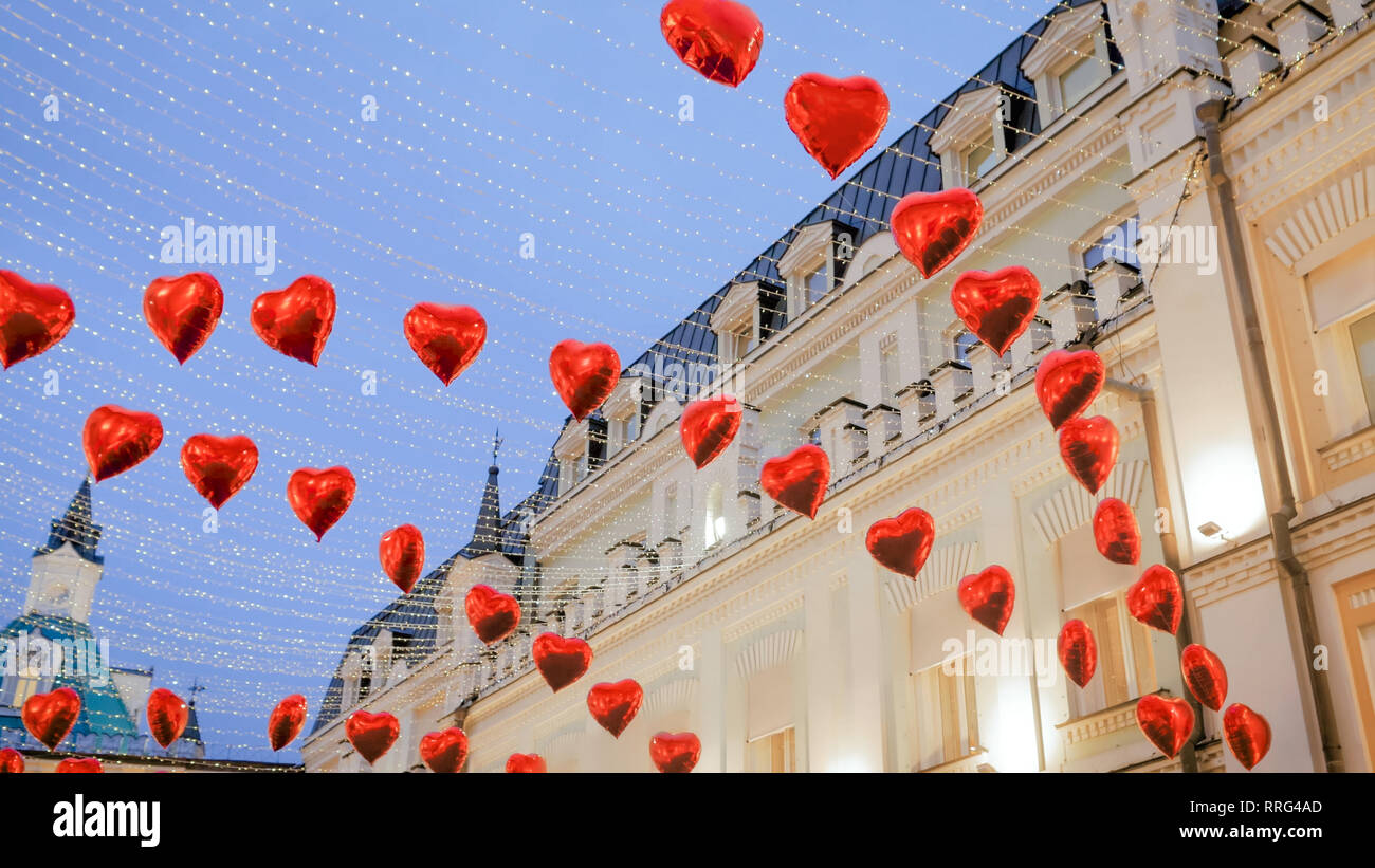 Red heart shape balloons waving in the wind Stock Photo - Alamy