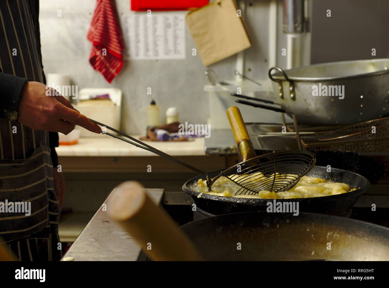 Chef at Chinese takeaway kitchen cooking king fried prawns Stock Photo ...