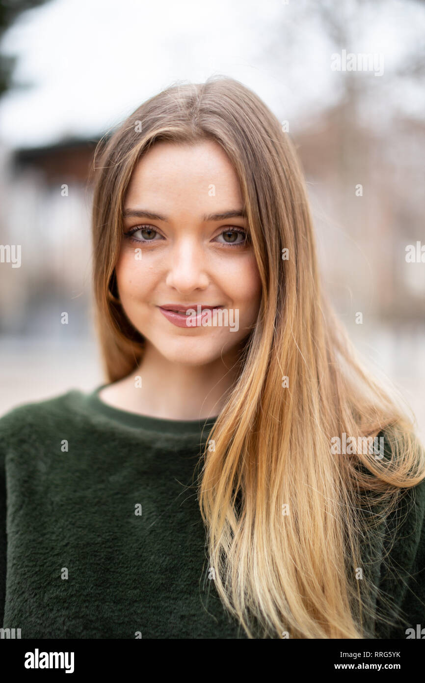 Portrait of happy smiling young blond woman in a park in autumn Stock ... Portrait of happy smiling young blond woman in a park in autumn Stock ...