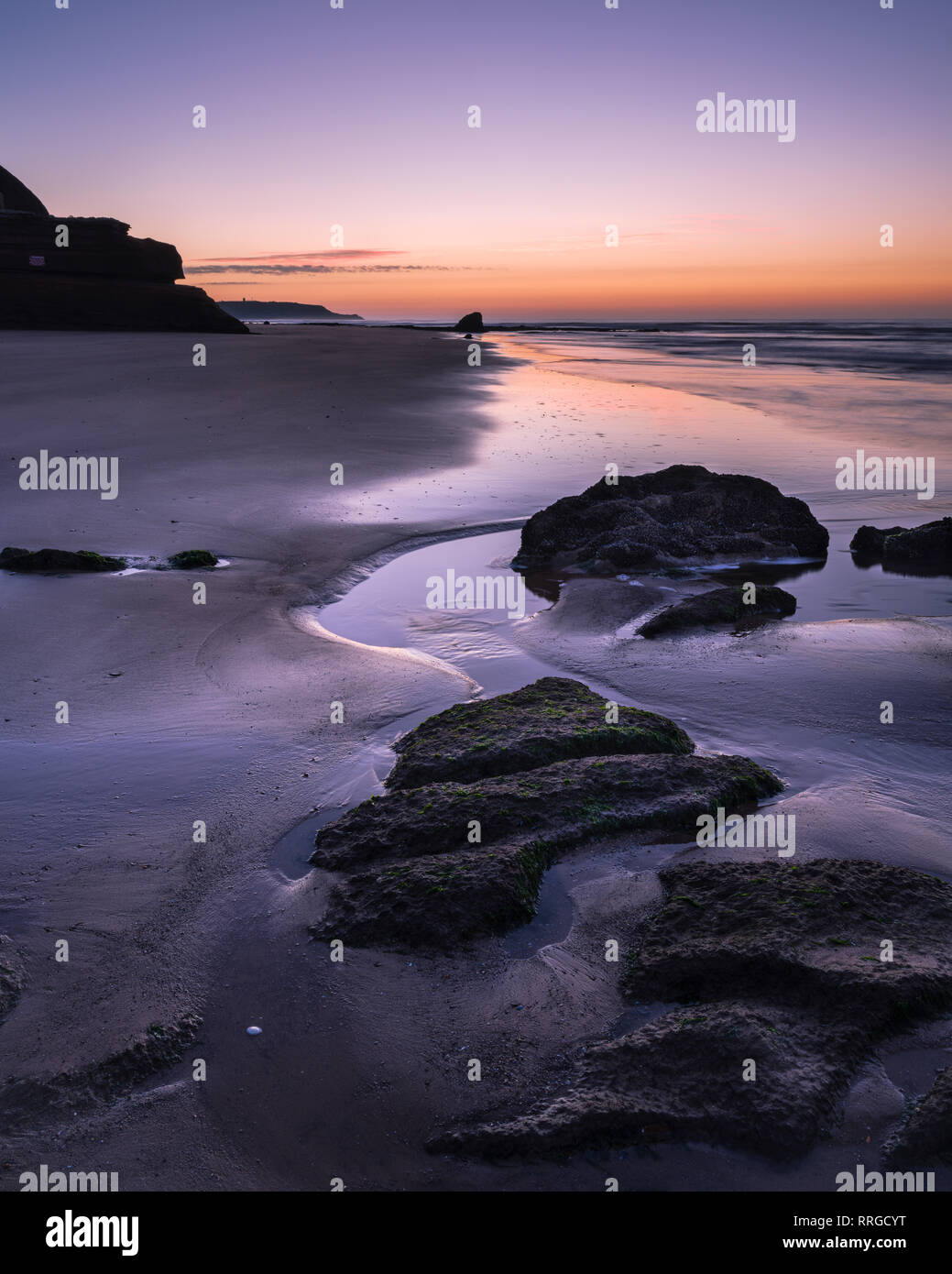 Dawn twilight with clouds on the beach at Orcombe Point, the Western ...