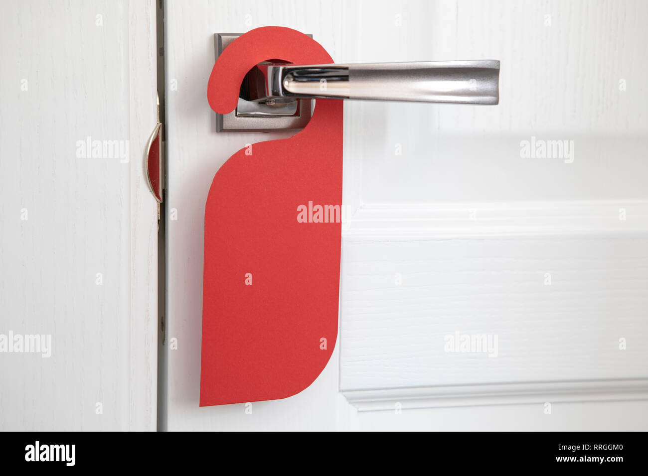 Hotel door handle with blank paper hanger Stock Photo - Alamy