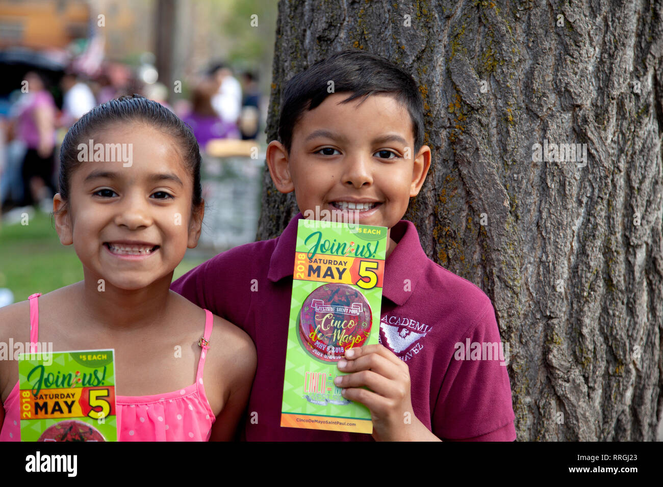 Two Hispanic children holding pins, buttons to support the Cinco de ...