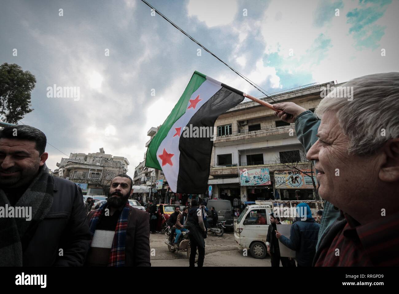 An activist seen waving a flag during the protest. The people and ...