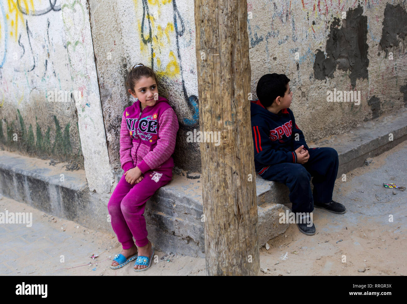 Palestinian kids are seen playing near their home at a refugee camp in ...