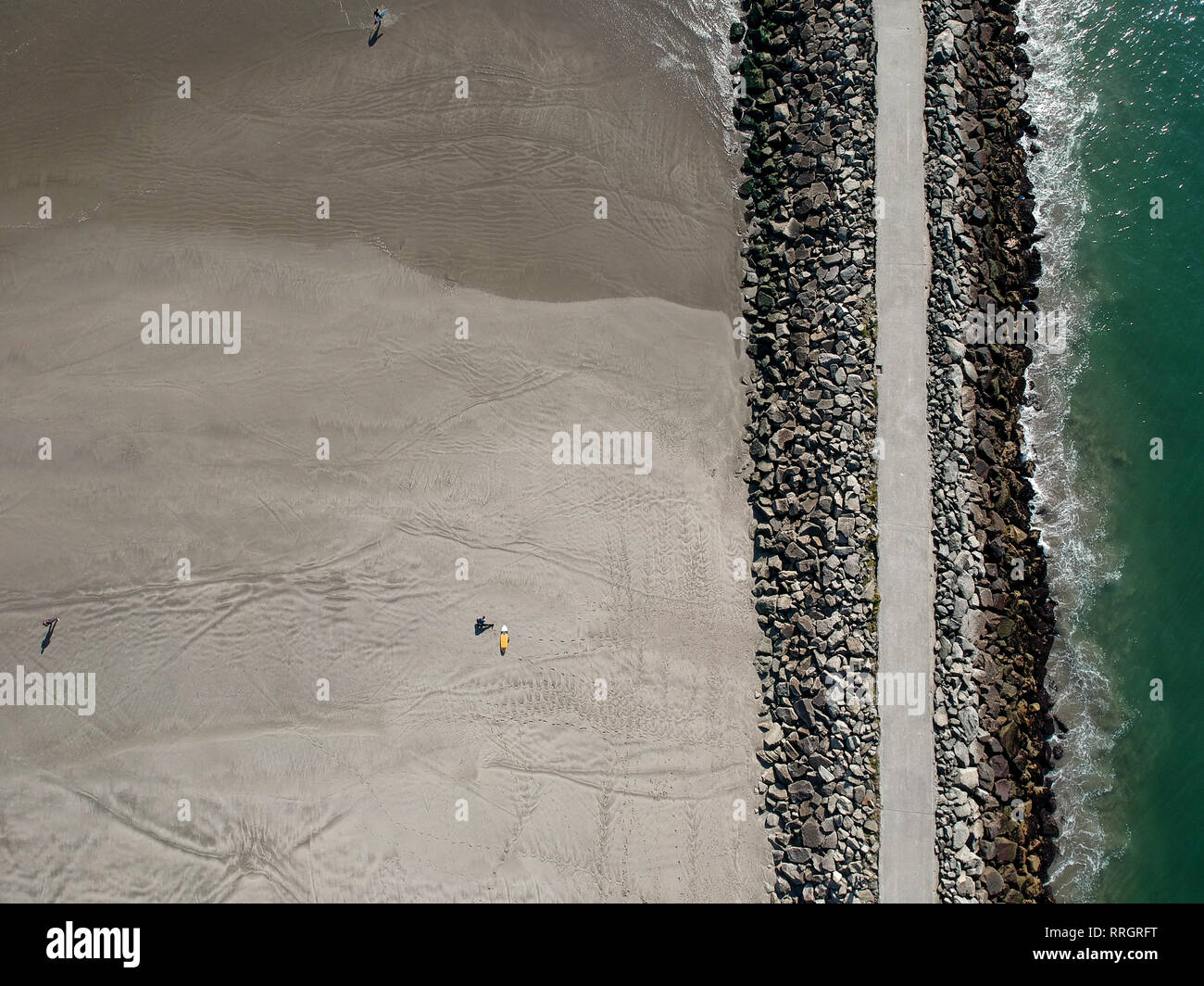 (EDITORS NOTE: Images taken by a drone) A surfer seen warming up before ...
