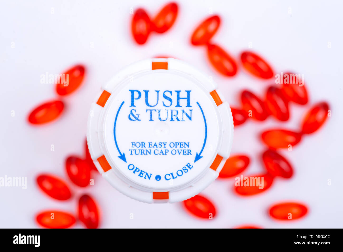 Docusate sodium red capsules and plastic container with Child-Resistant ...