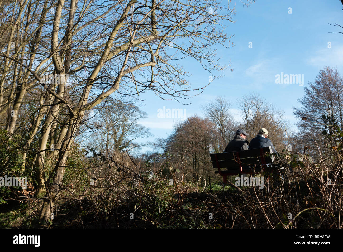 Two pensioners sitting in front of Wire Mill Dam in the Porter Valley ...
