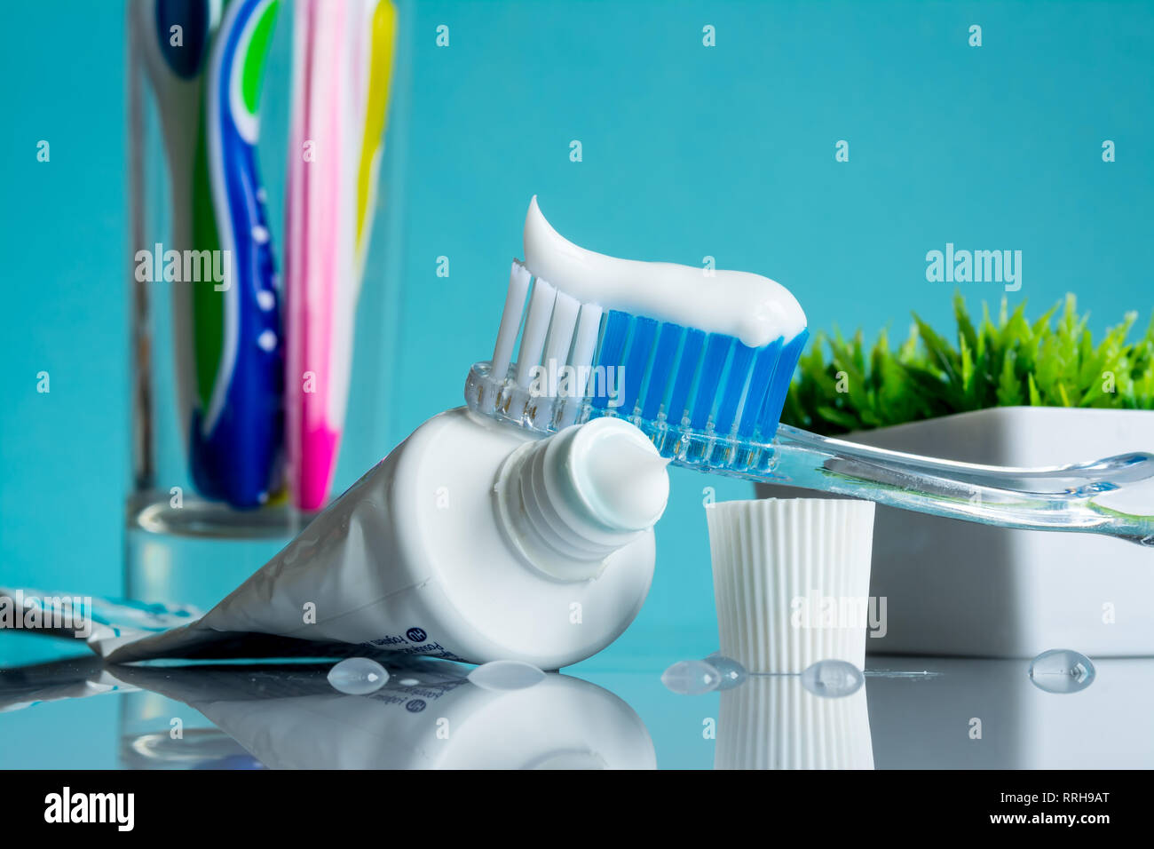 New toothbrush with toothpaste close-up in the bathroom on a mirror ...