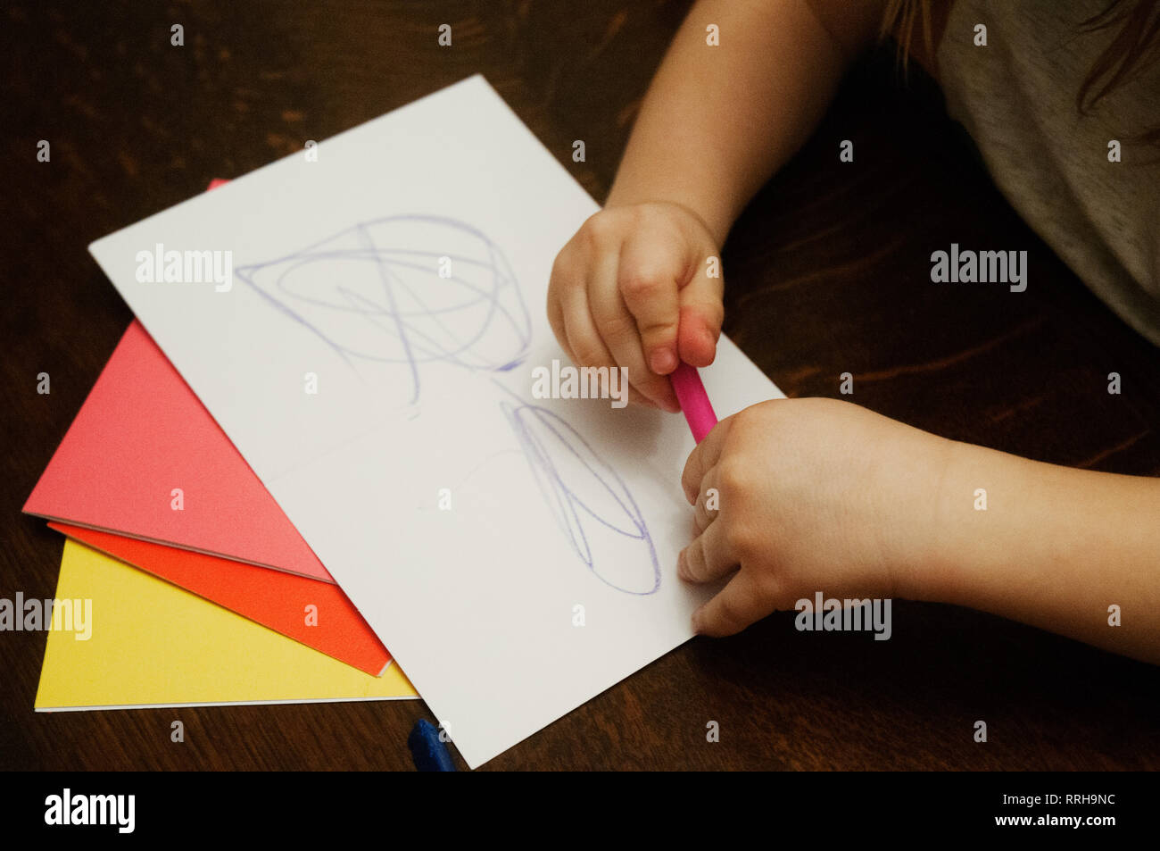 Young Boy with Pink Crayon Drawing on Blank Card Stock Photo - Alamy