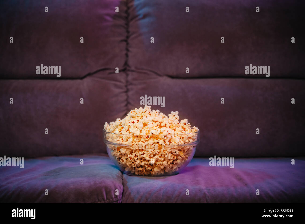 Hot popcorn in a bowl on the couch Stock Photo - Alamy