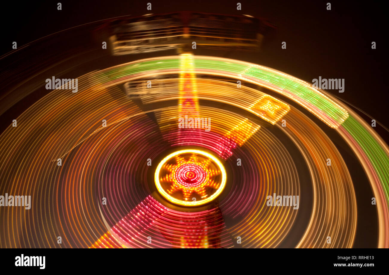 Long exposure night shot of the Kamikaze ride at the carnival midway ...