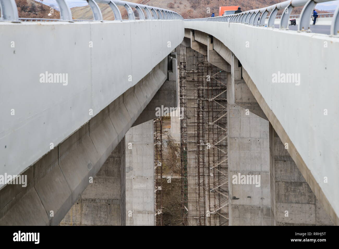 Bottom view on the bridge. Big concrete overpass. Building of the ...