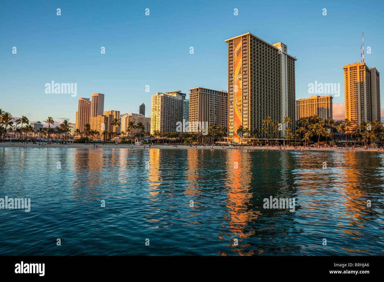 A view of the Hilton Hawaiian Village and Waikiki beach at sunset Stock ...