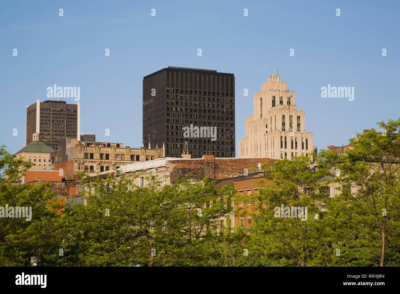 Old Montreal skyline through trees in spring, Quebec, Canada Stock ...