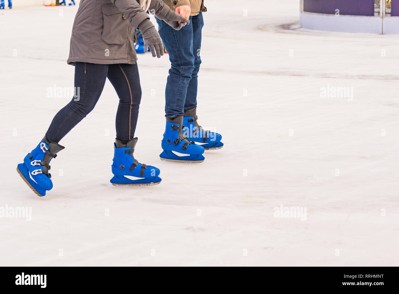 People skating at an ice skating rink Stock Photo - Alamy