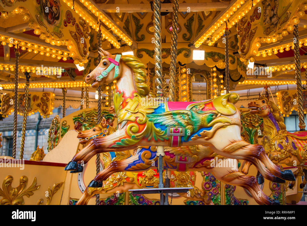 Colorful horse carousel at an amusement park Stock Photo - Alamy