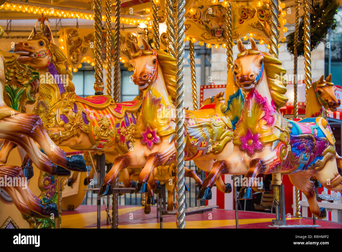 Colorful horse carousel at an amusement park Stock Photo - Alamy