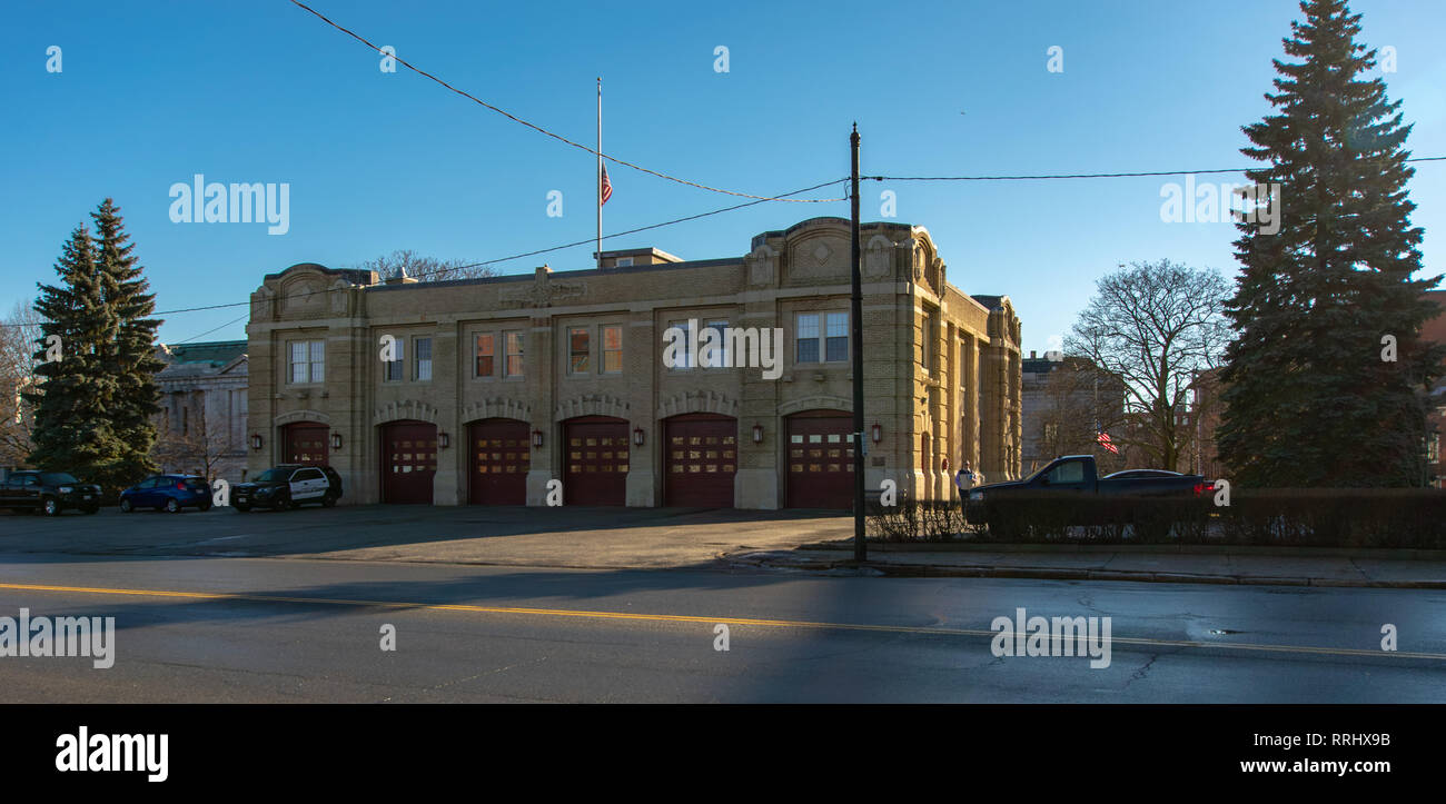 Old brick firehouse with red doors Stock Photo - Alamy