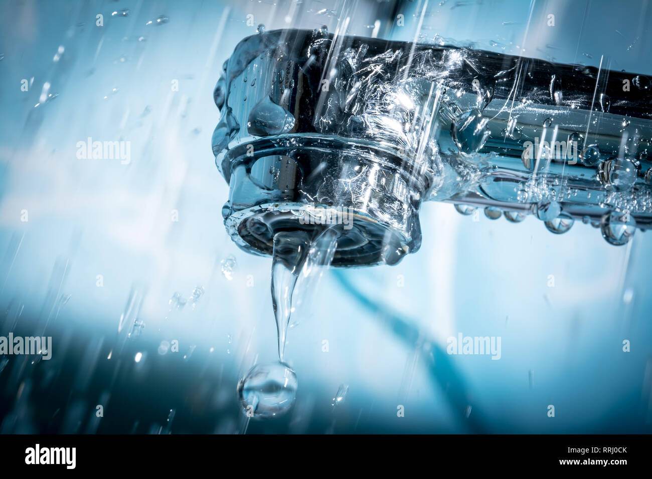 Water flows from a modern chromed water tap faucet macro close-up Stock ...