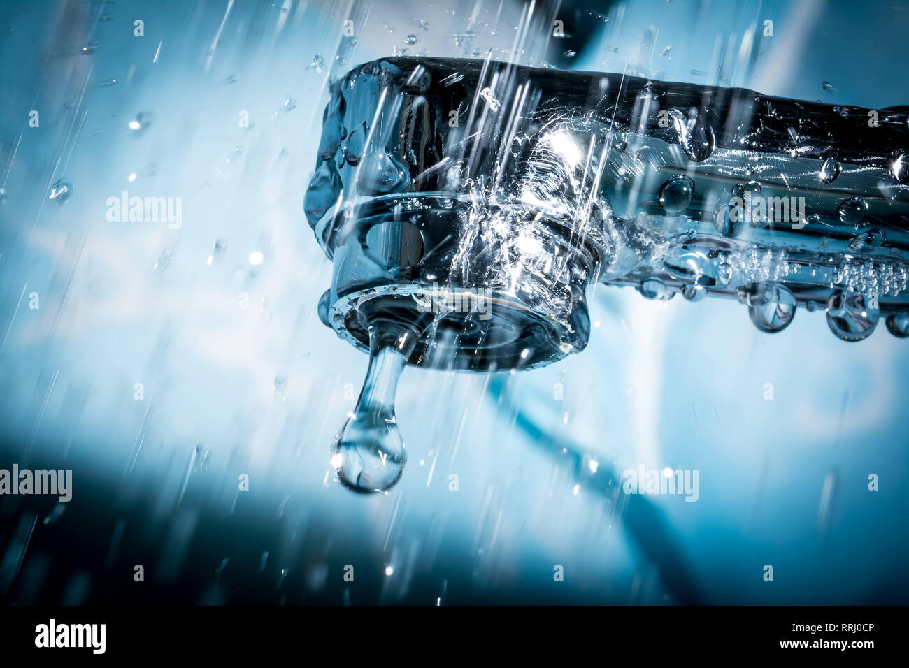 Water flows from a modern chromed water tap faucet macro close-up Stock ...