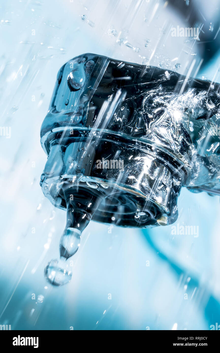 Water flows from a modern chromed water tap faucet macro close-up Stock ...
