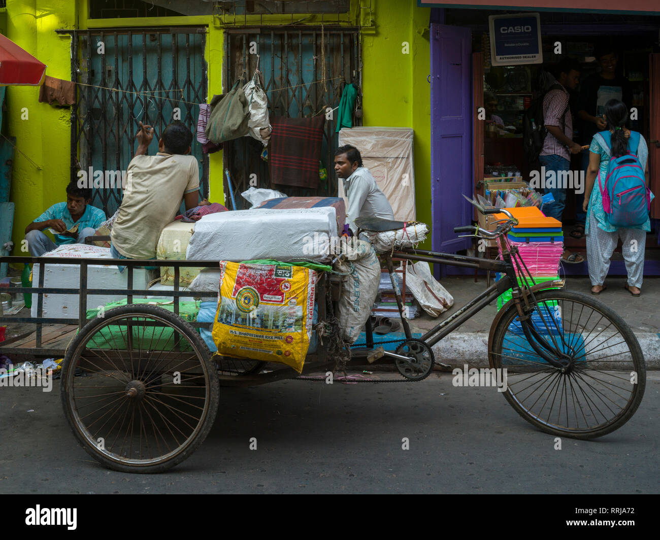 Loaded rickshaw in front of a store, Kolkata, West Bengal, India Stock ...