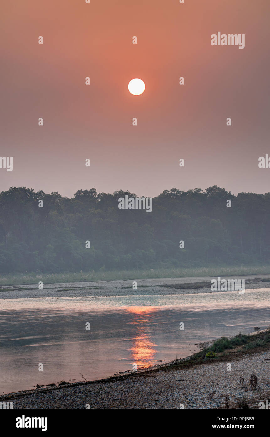 Sunset at Chitwan National Park in Nepal Stock Photo - Alamy