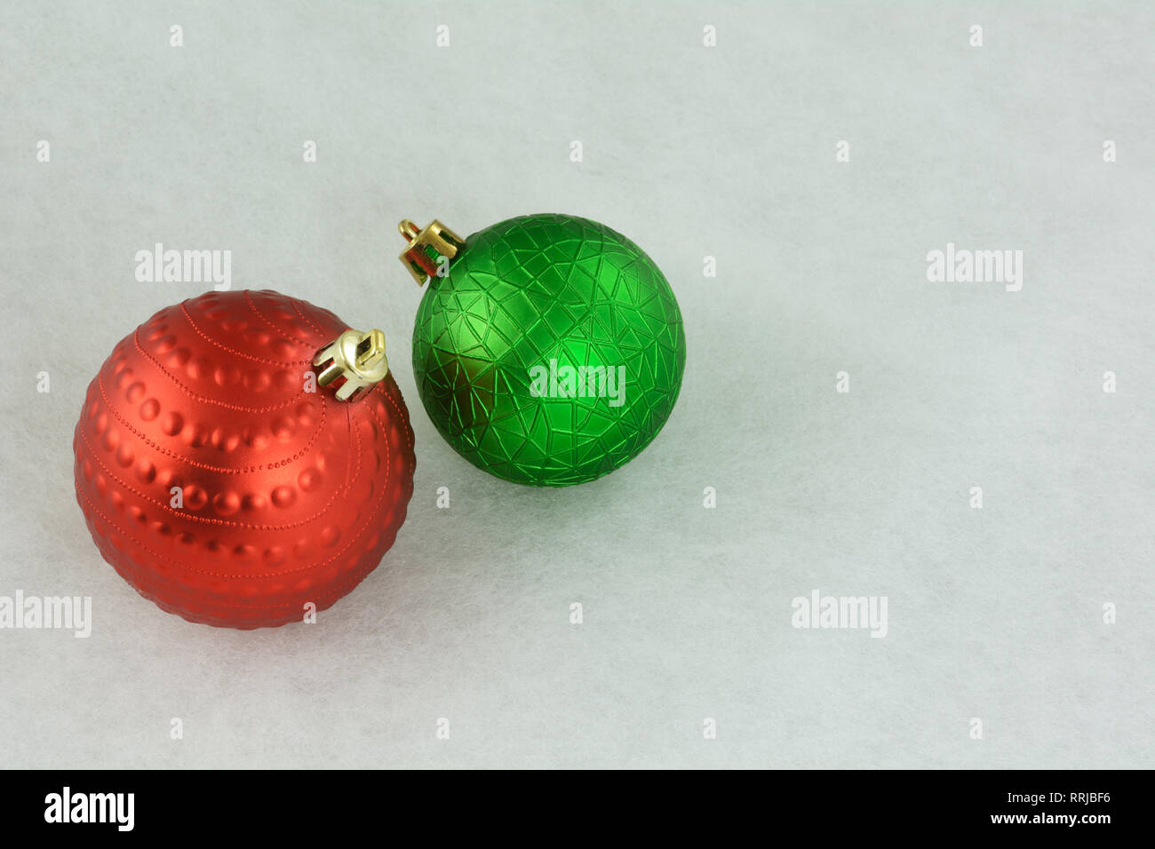 Red and green Christmas ornaments on white background Stock Photo - Alamy