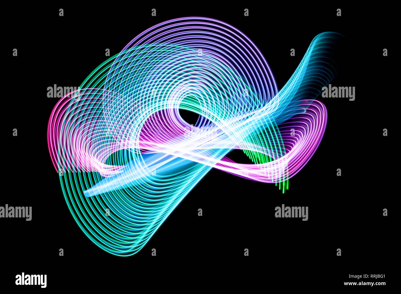 Abstract rainbow neon glowing crossing lines pattern. Dark background of colorful neon glowing ...