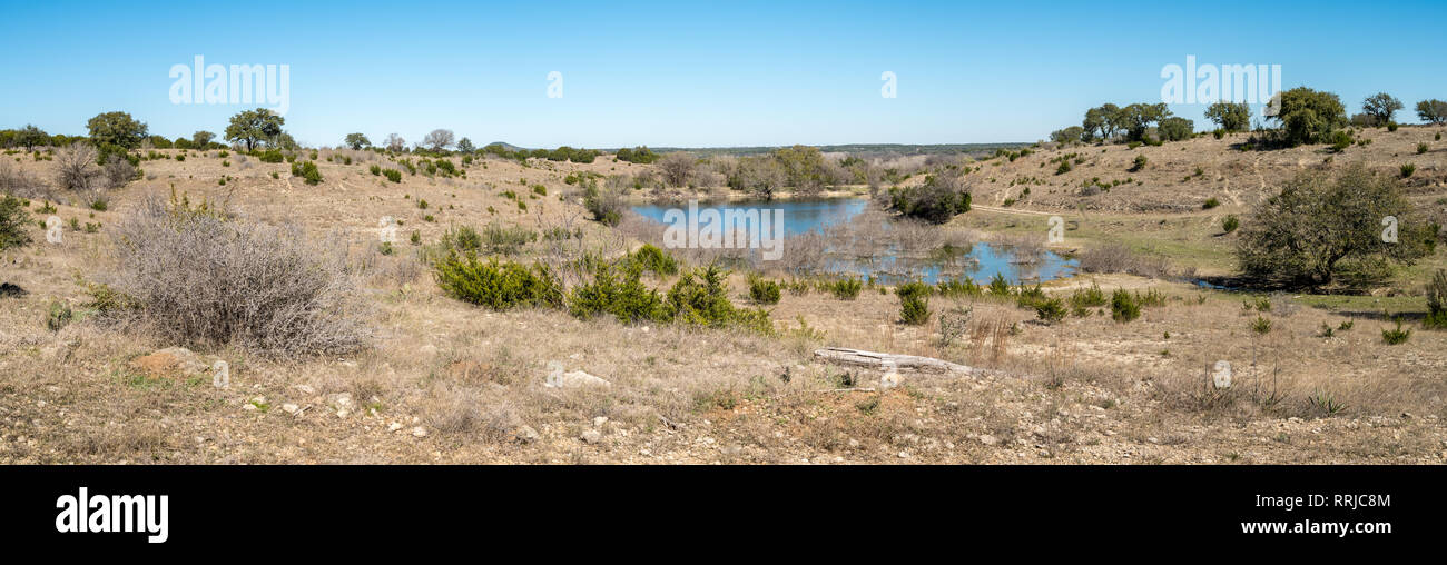 Panoramic View of Large Farm Land with Body of Water Stock Photo - Alamy