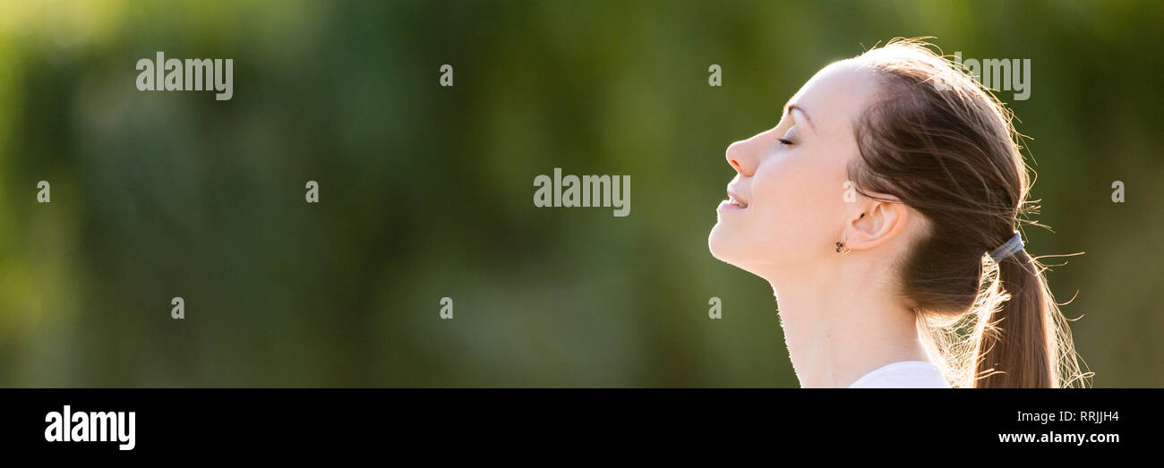 Panoramic side view woman face breathing fresh air outdoors Stock Photo ...