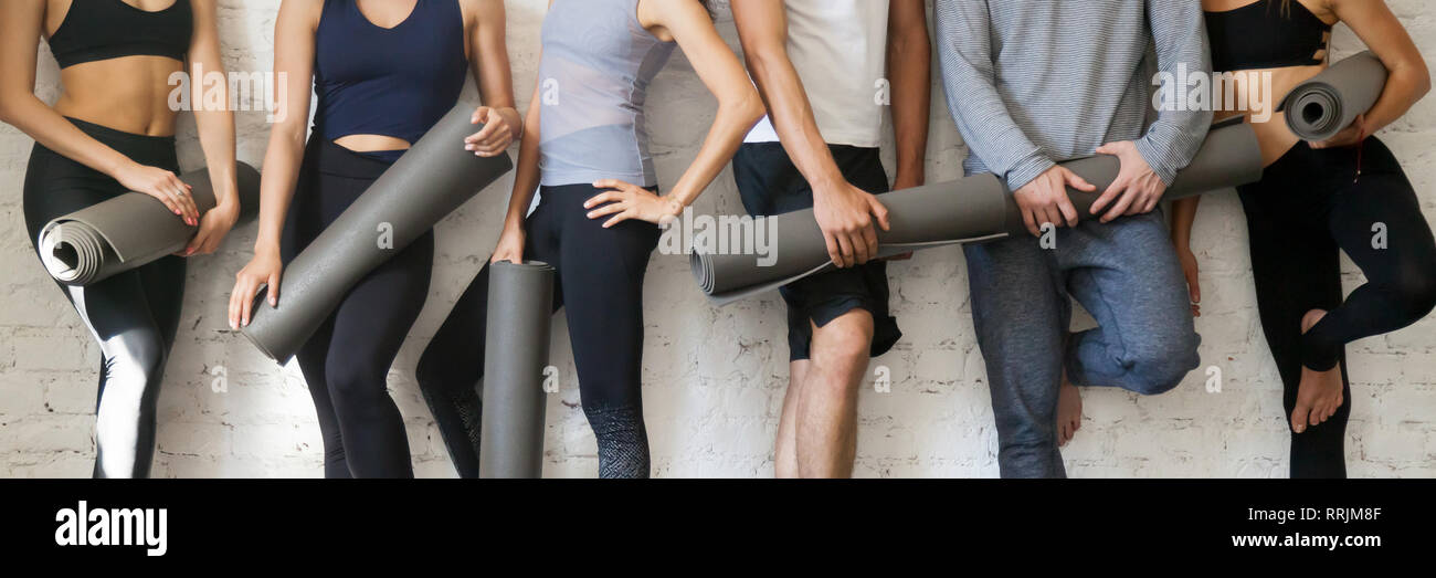 Horizontal photo group young sporty people wearing activewear holding ...