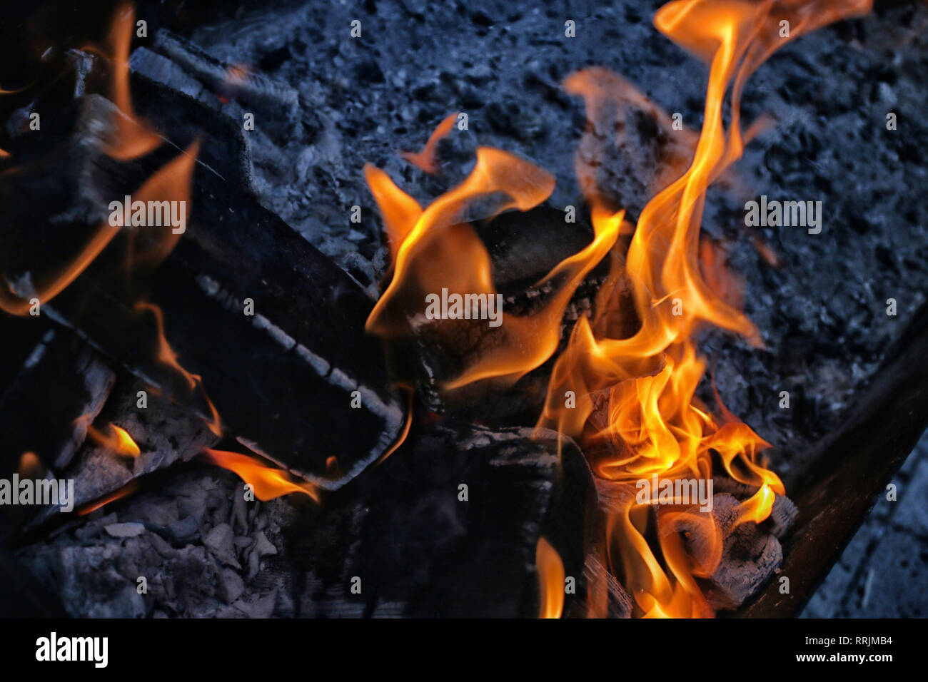 image of burning fire with burnt firewood macro photo Stock Photo - Alamy