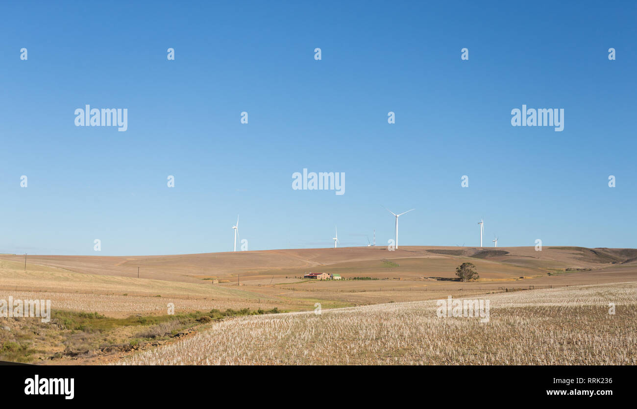 agricultural land with wind turbines scattered around the various farms ...