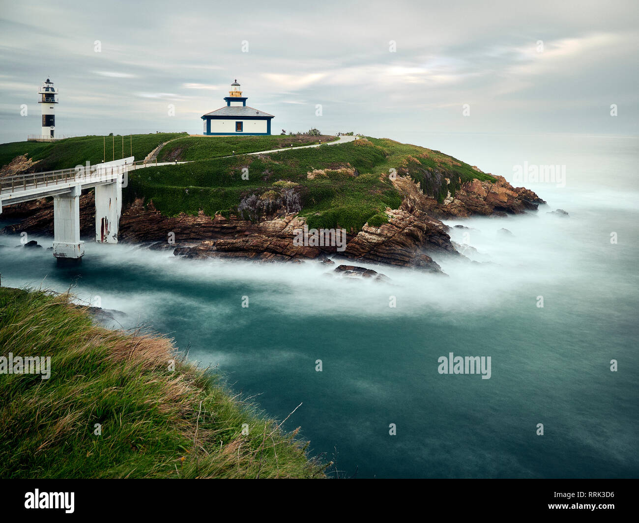 island with a lighthouse with the movement of the waves Stock Photo - Alamy
