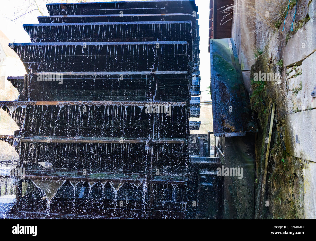 Water wheel made of metal and wood in use, carries water Stock Photo ...
