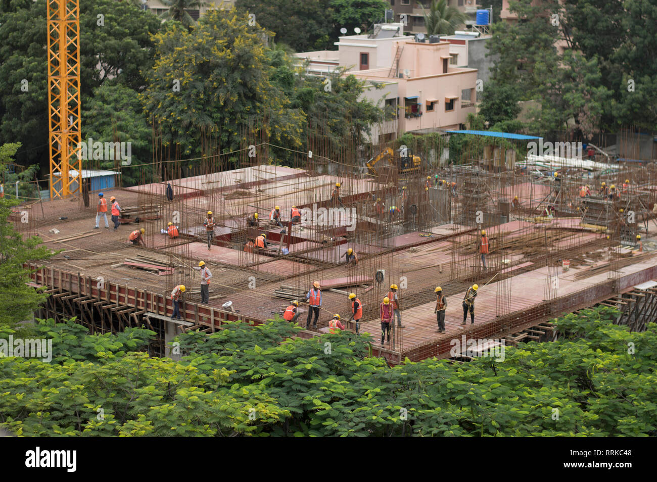 Construction workers laying slab at a construction site Stock Photo - Alamy