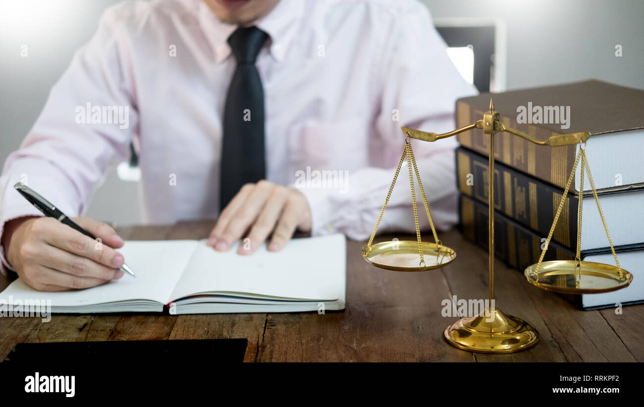 lawyer judge reading documents at desk in courtroom working on wooden ...