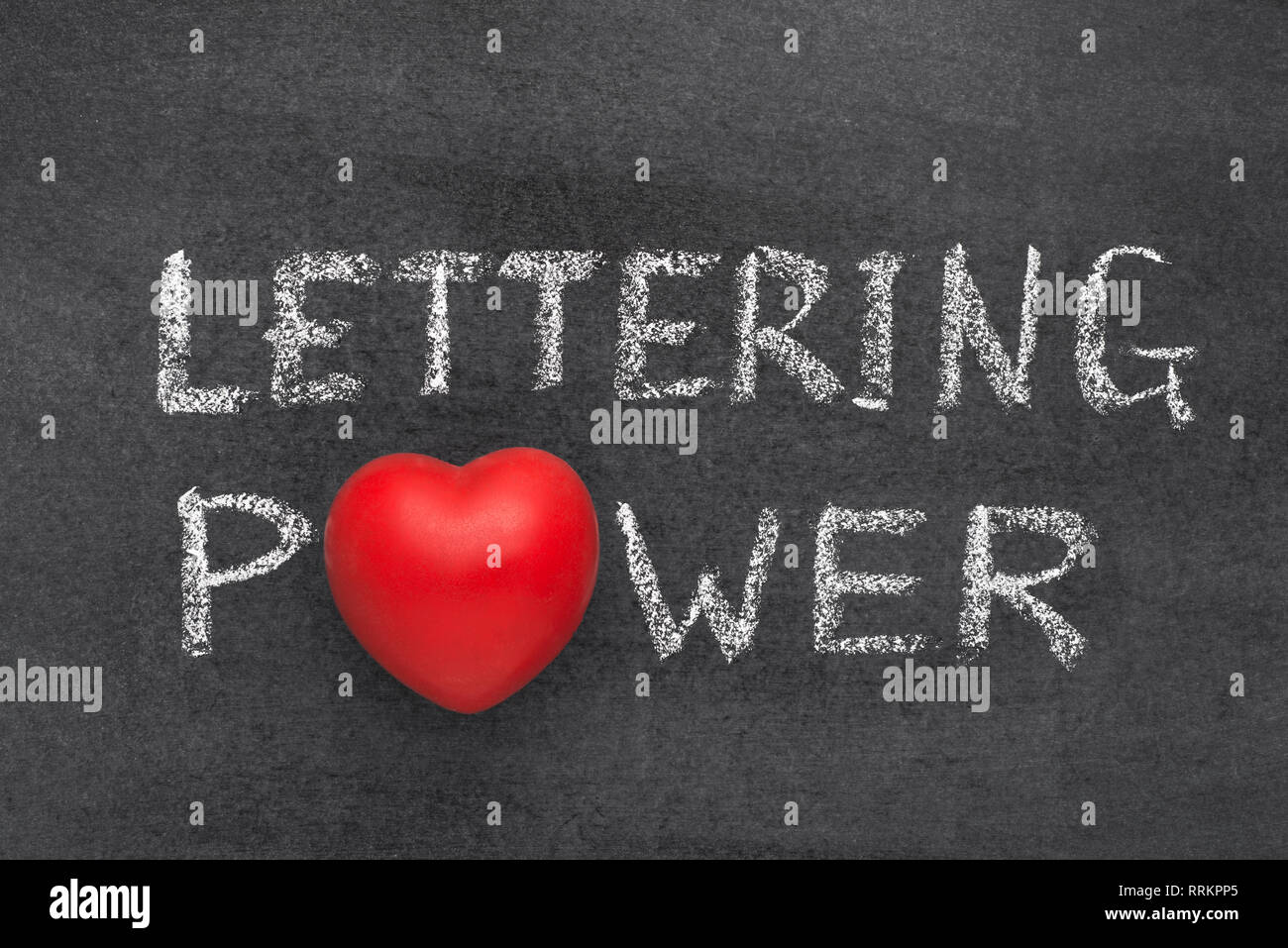 lettering power phrase handwritten on blackboard with heart symbol ...