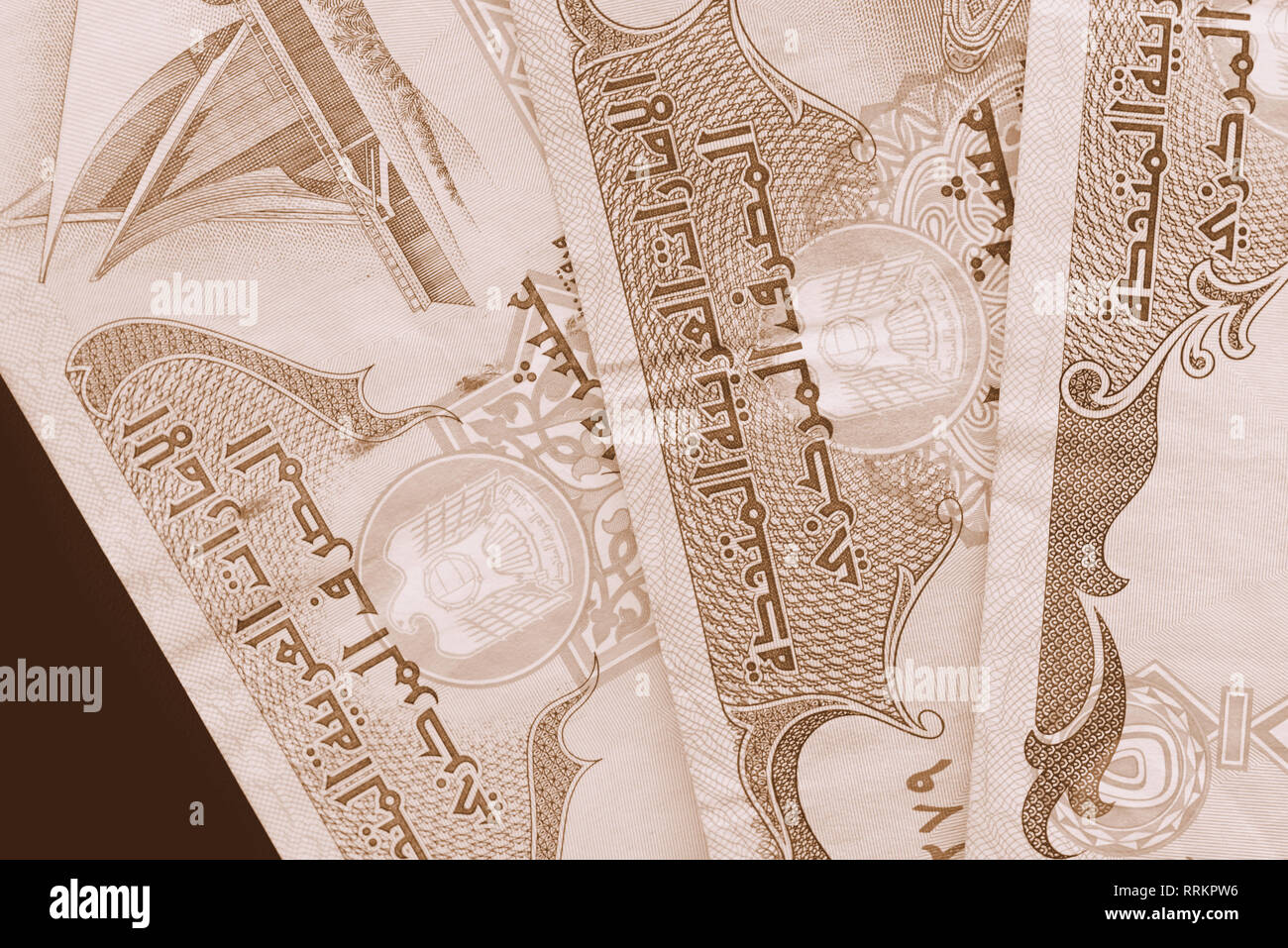 UAE dirham currency background close up. Brown color toned Stock Photo ...