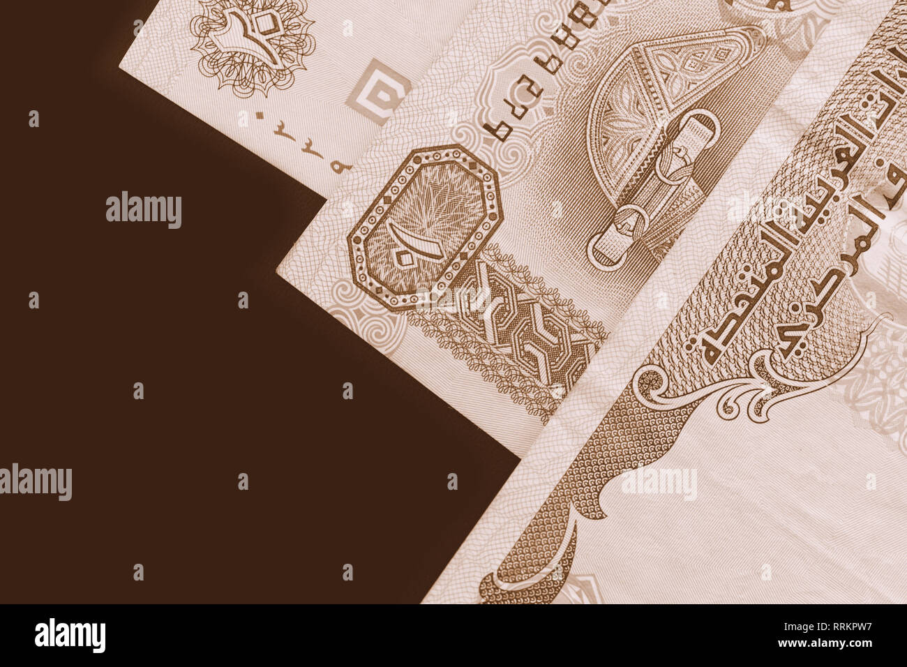 UAE dirham currency background close up. Brown color toned Stock Photo ...
