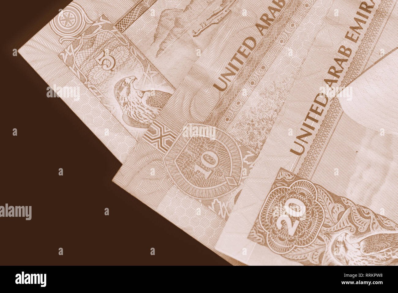 UAE dirham currency background close up. Brown color toned Stock Photo ...